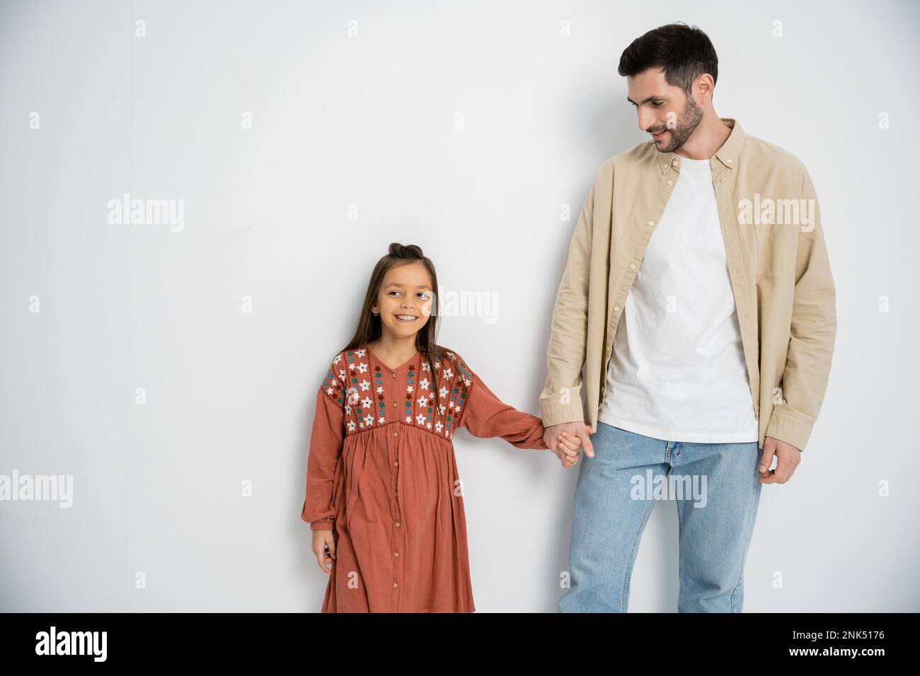 Handsome man holding daughter hand hi-res stock photography and images ...
