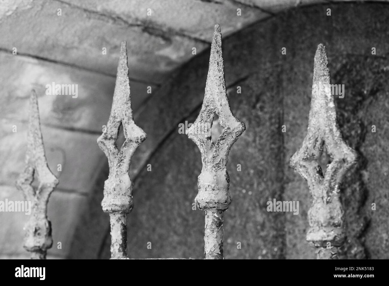 Vintage traditional rusty metal fence with sharp points as a protection ...
