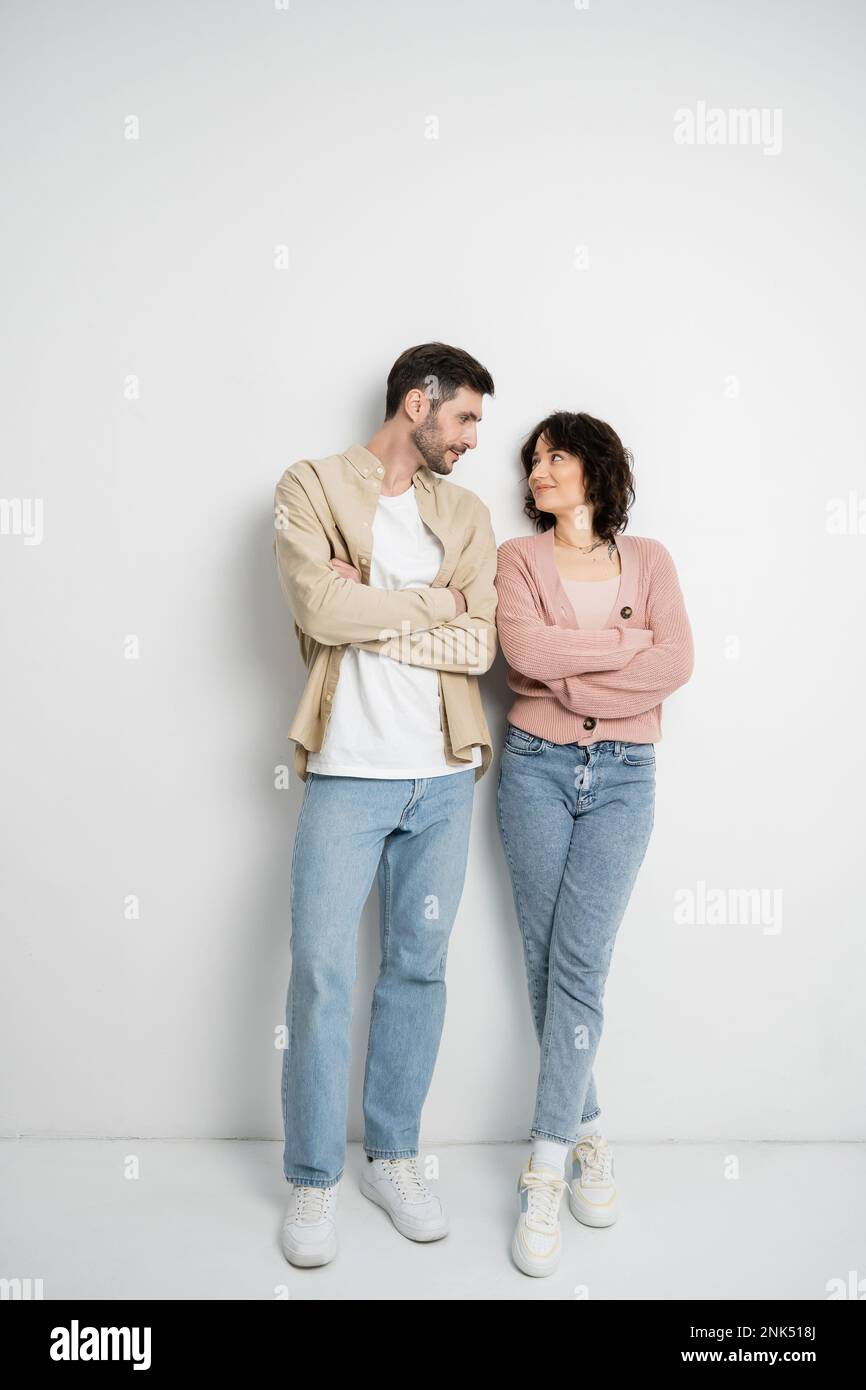 Couple crossing arms hi-res stock photography and images - Alamy