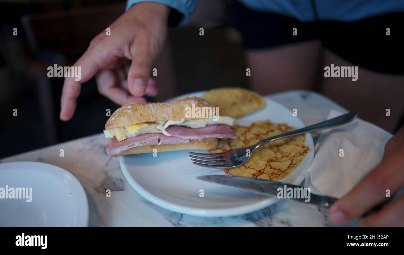 Hand preparing sandwich. Person making snack food to eat later Stock ...