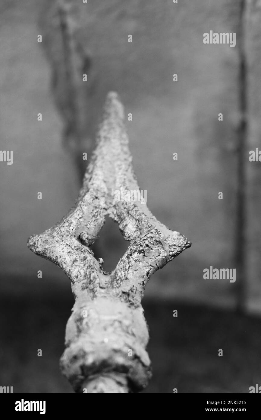 Vintage traditional rusty metal fence with sharp points as a protection ...