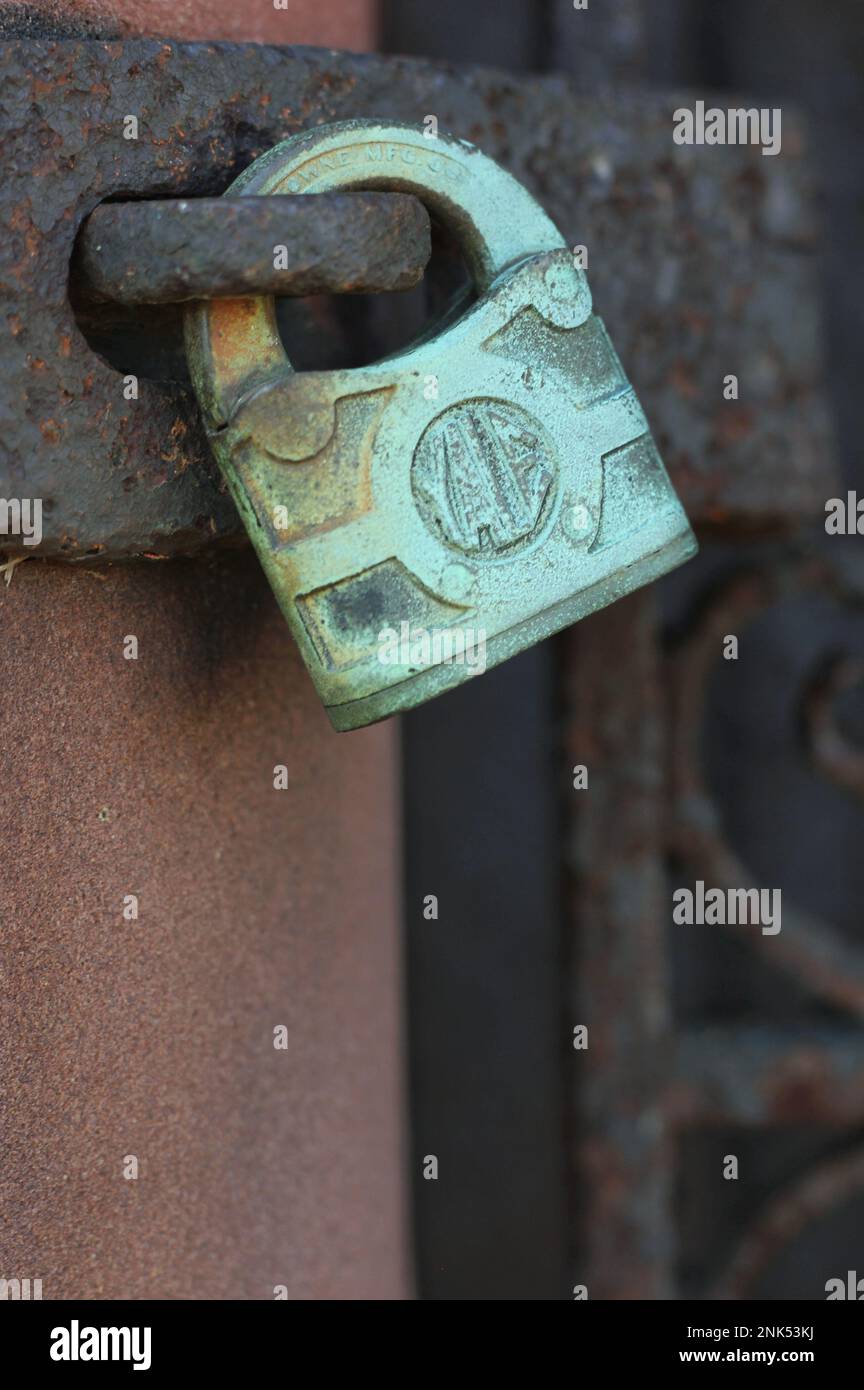 Vintage traditional metal padlock keeping a gate closed Stock Photo - Alamy