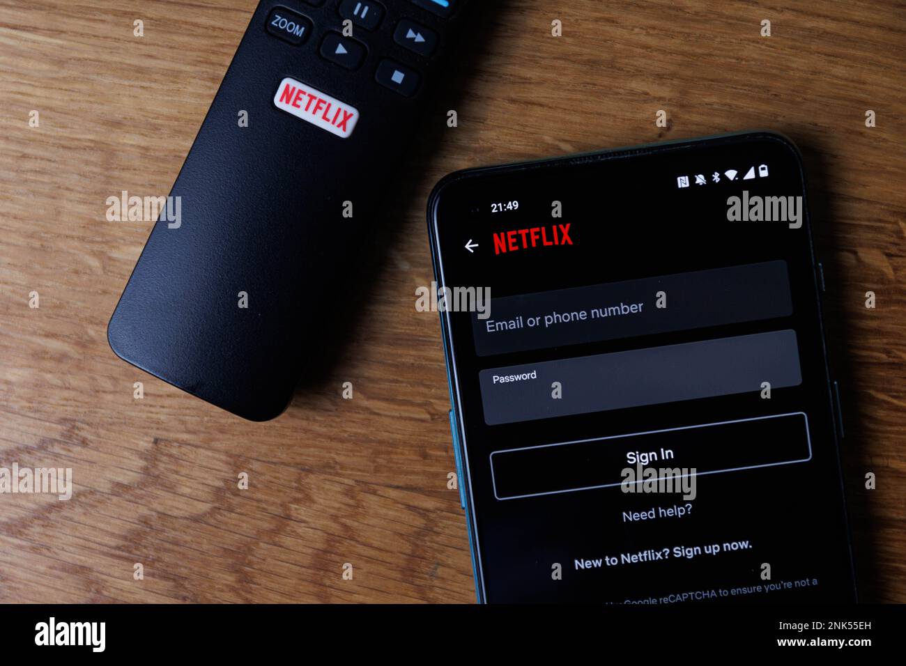Netflix login on smartphone display. New password sharing rules on ...