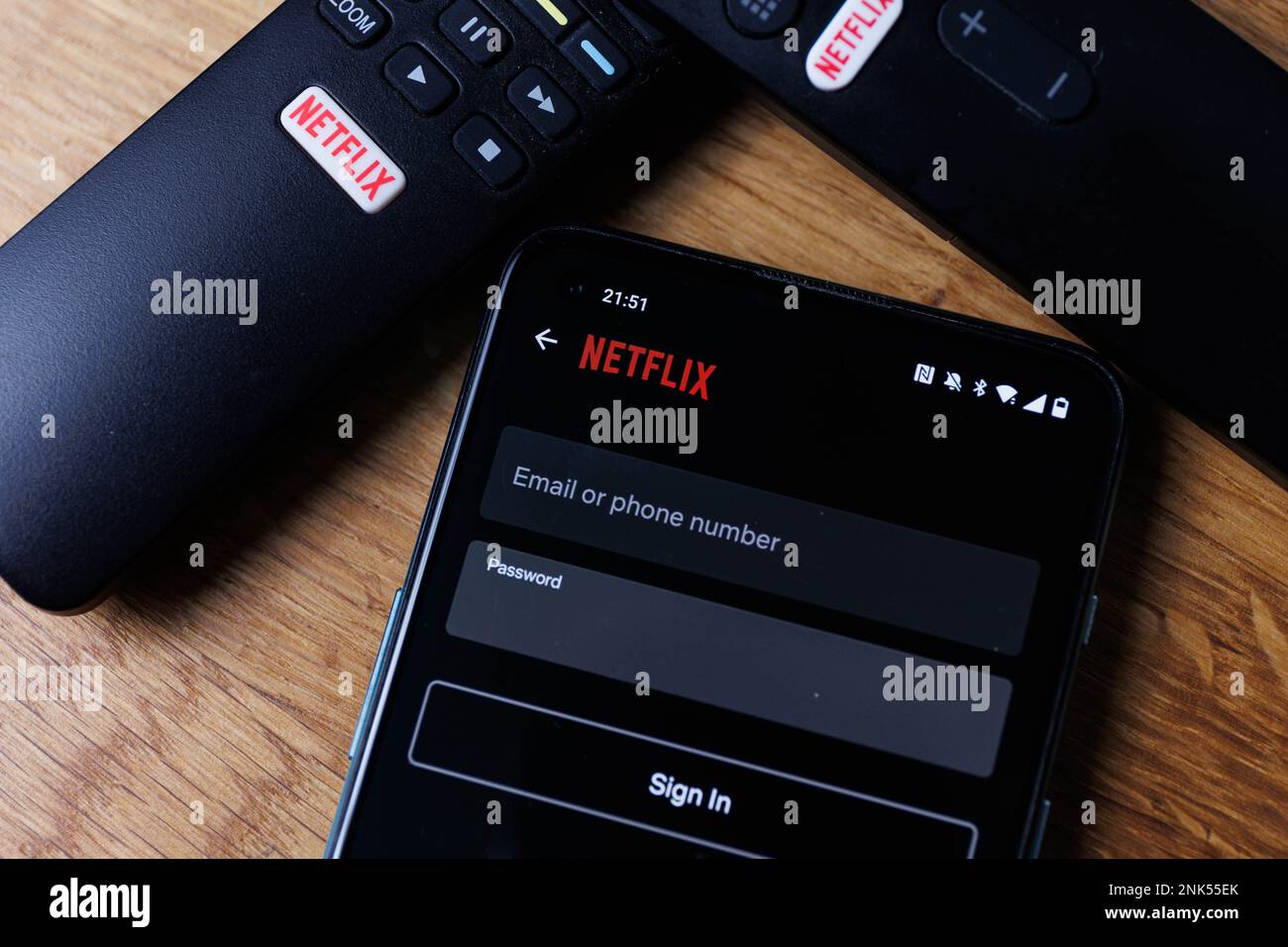 Netflix login on smartphone display. New password sharing rules on ...