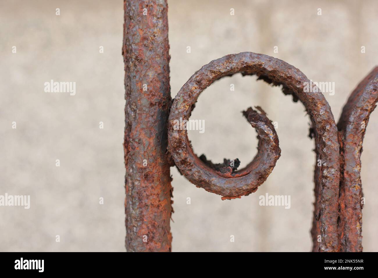 Rusted curly medieval metal gate decorations Stock Photo - Alamy