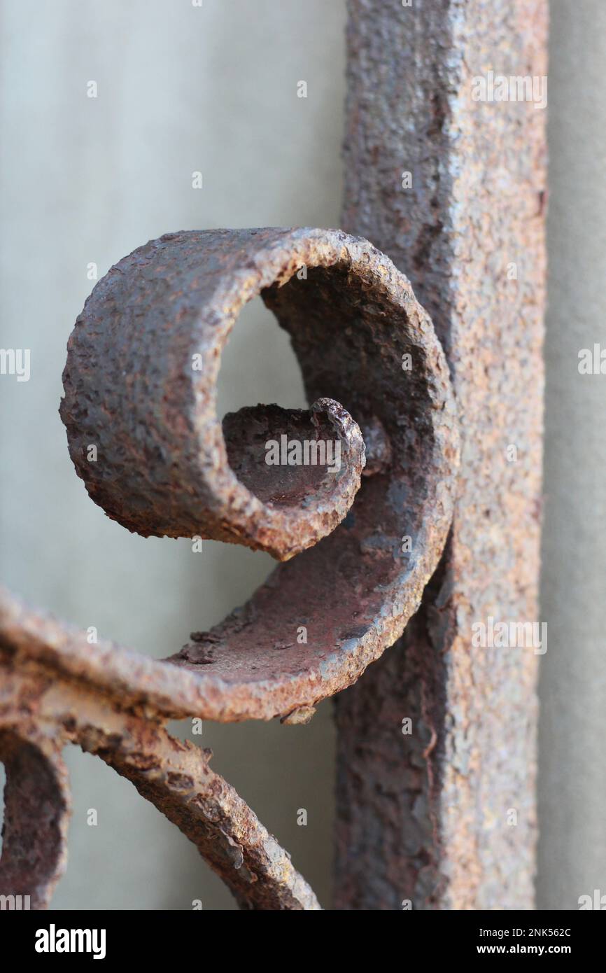 Rusted curly medieval metal gate decorations Stock Photo - Alamy