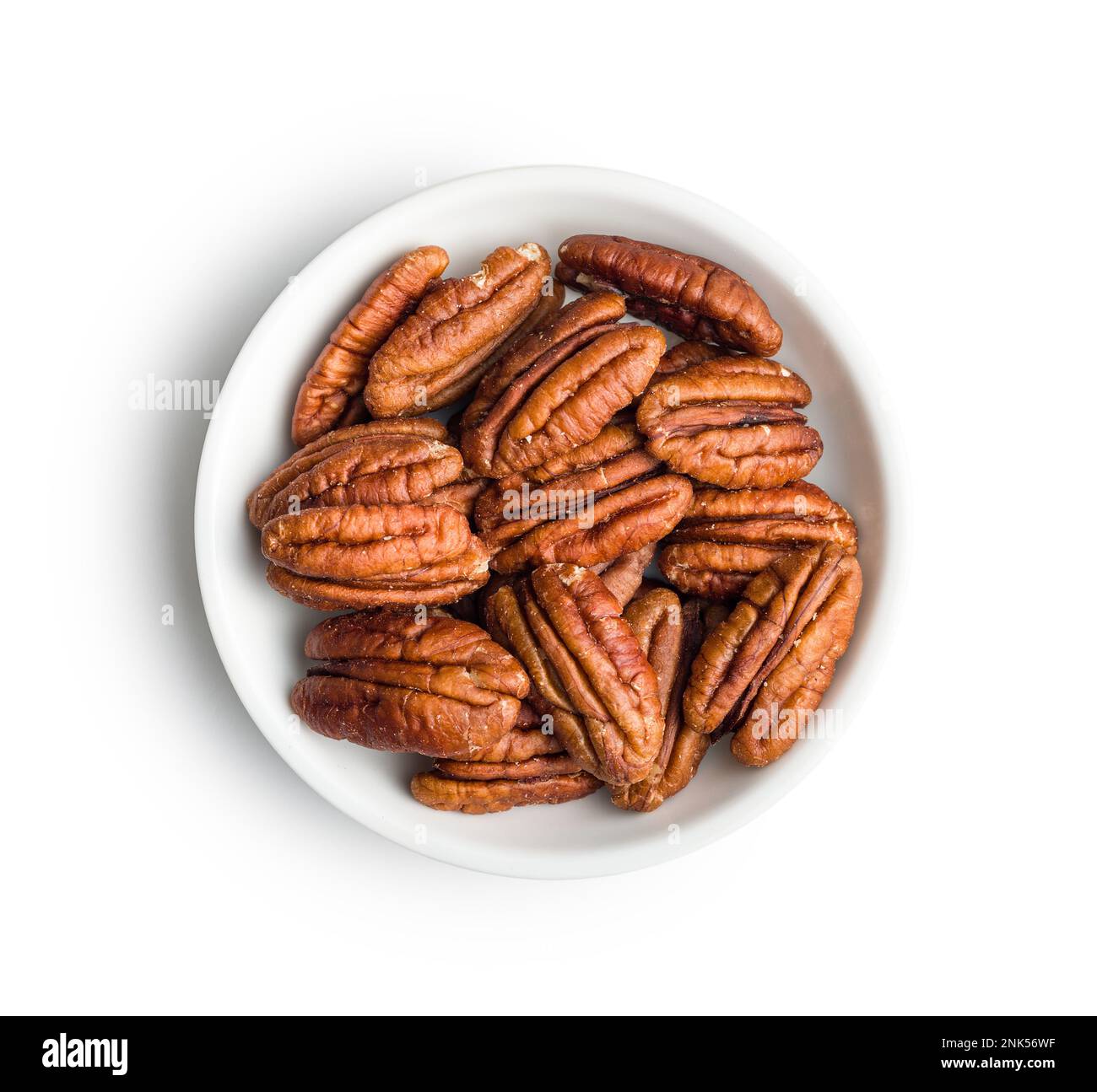 Peeled pecan nuts in bowl isolated on the white background Stock Photo ...