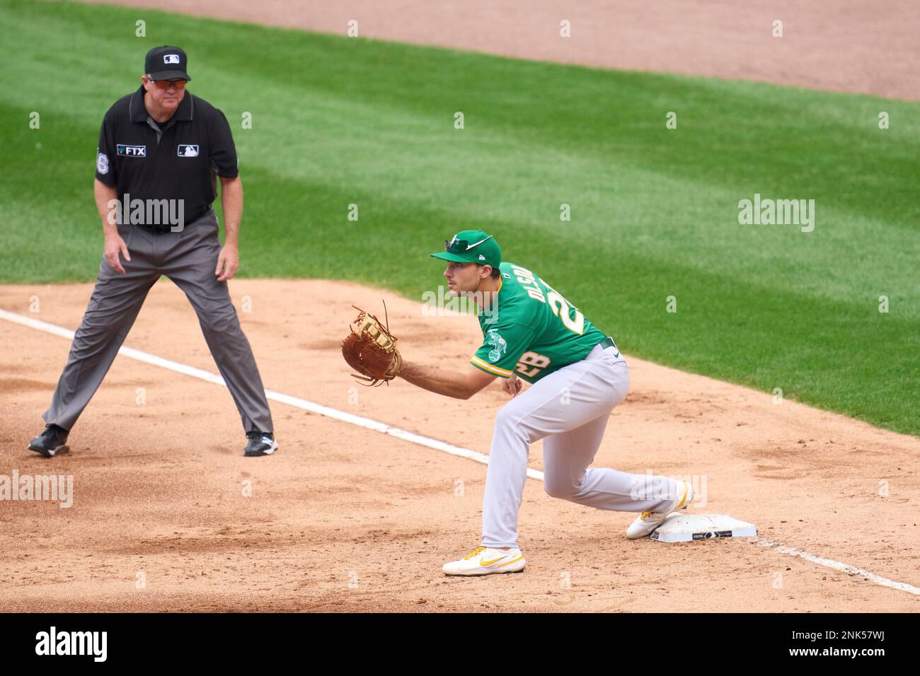 Oakland Athletics first baseman Matt Olson (28) stretches for a throw ...