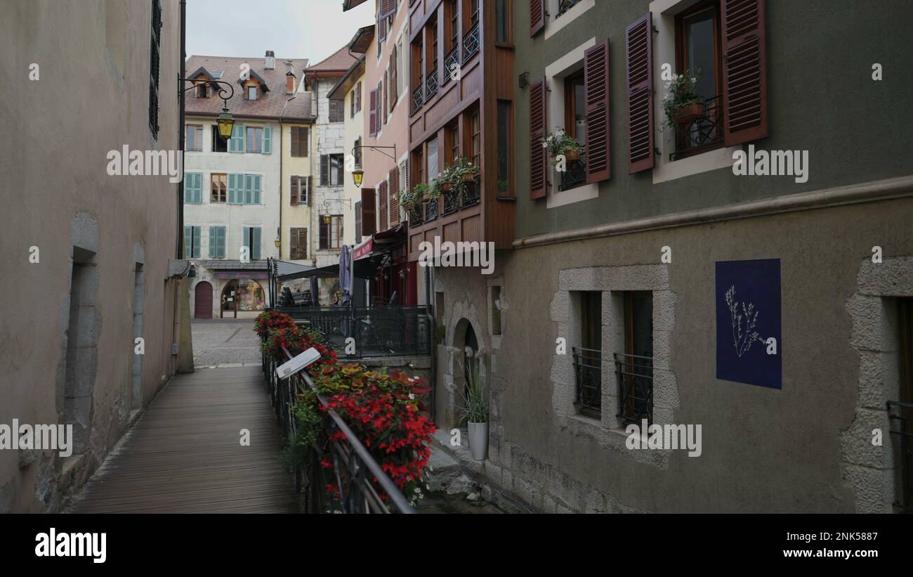 Charming traditional French street in Annecy. Old antique European ...
