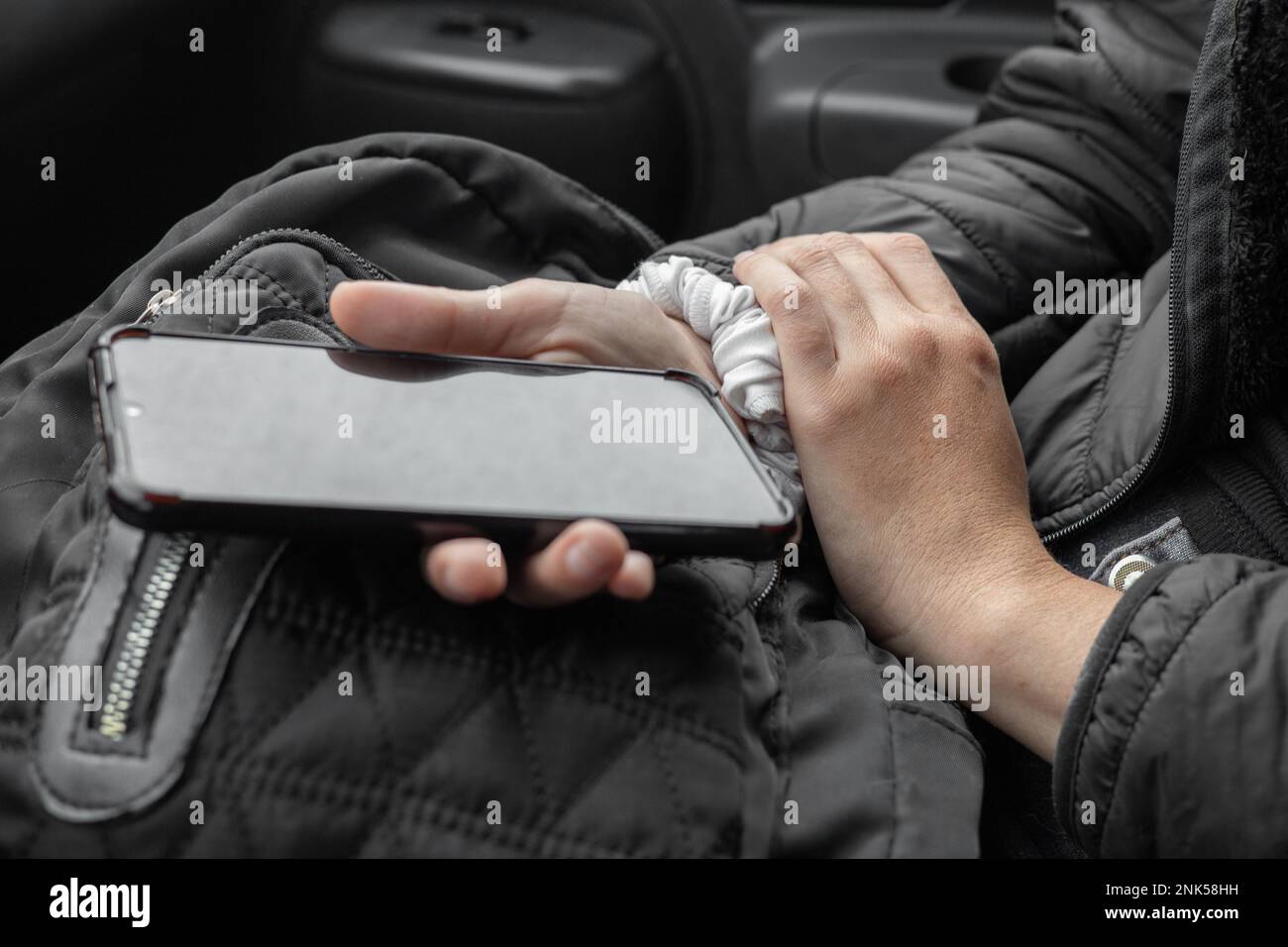 Hands holding a cell phone, Mobil device tactile screen details ...