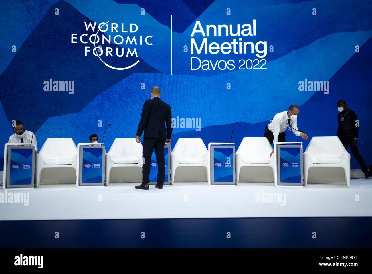 Workers set the stage prior the annual meeting of the World Economic ...