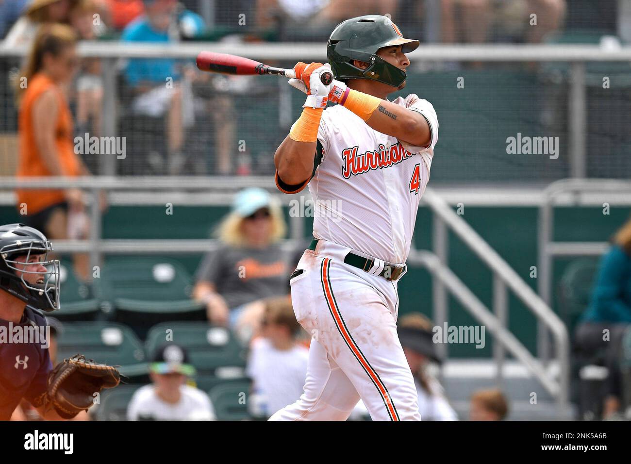 CORAL GABLES, FL - MAY 21: Miami catcher Maxwell Romero Jr. (4) hits a ...