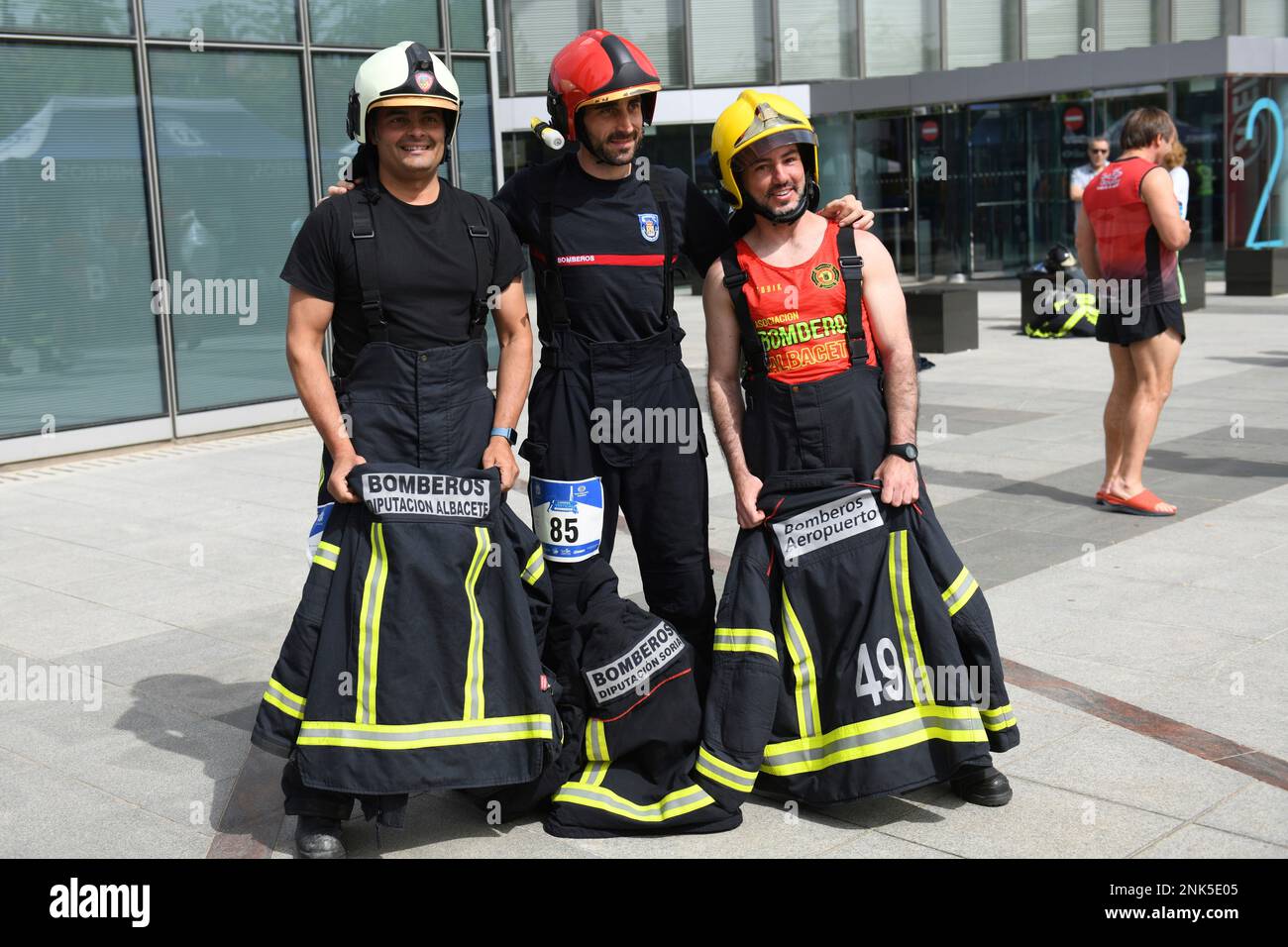 Three firefighters posing at the Madrid City Council's Vertical ...
