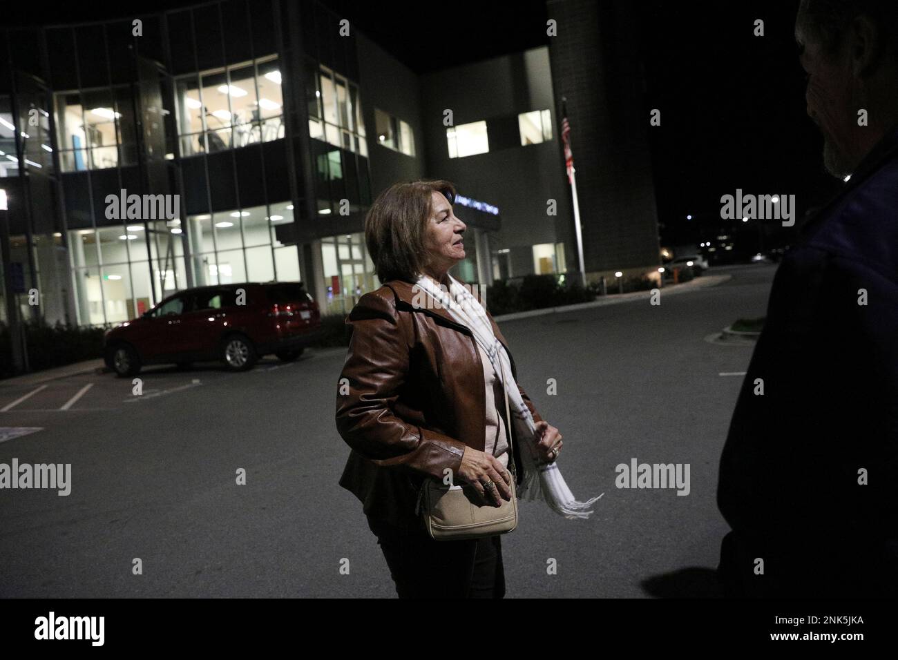 Susan Choate-Brye stands in the parking lot after a visiting with her ...