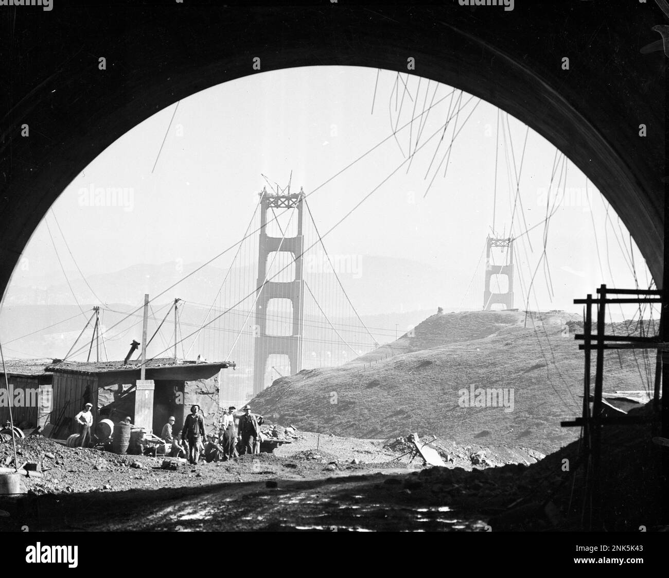 A shot of bridge workers north of the Golden Gate Bridge with the ...