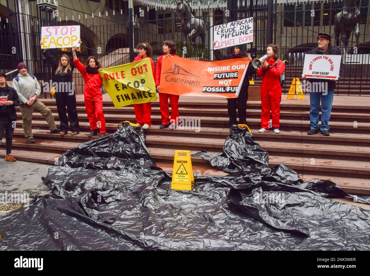 London, UK. 23rd Feb, 2023. Protesters holding banners and placards ...