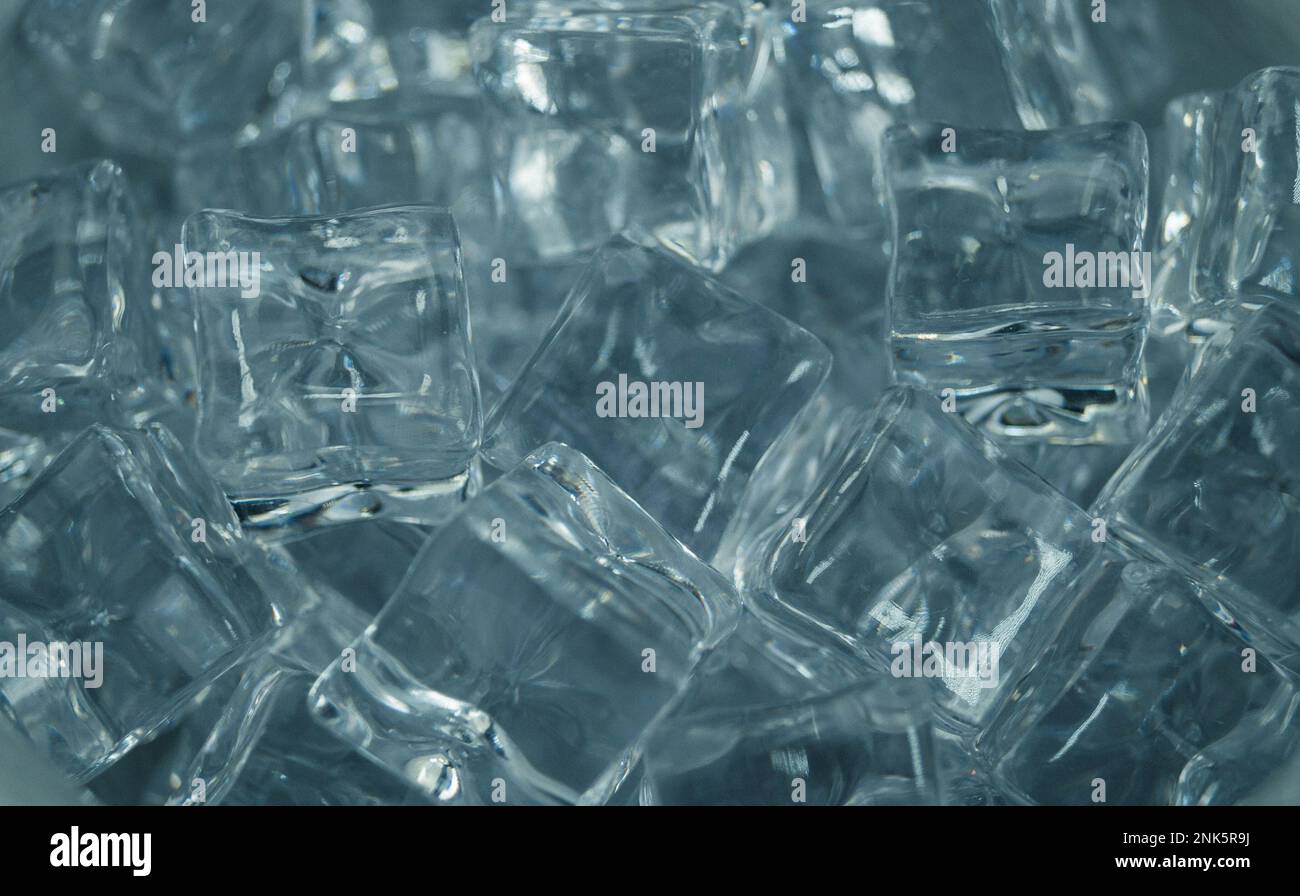 diffuse light shines on a handful of ice cubes Stock Photo - Alamy