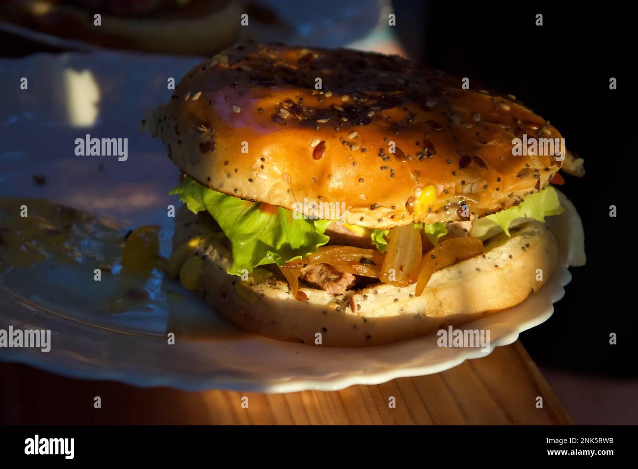 a burger in the light Stock Photo - Alamy