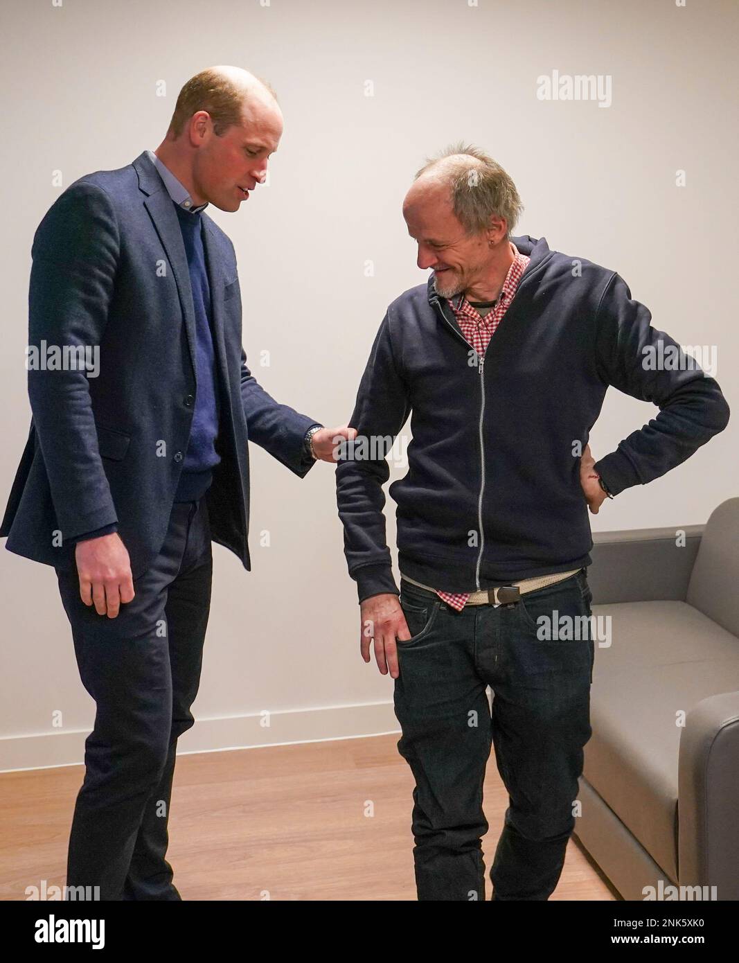 The Prince of Wales (left) speaks with resident Mark Chiverton, during ...