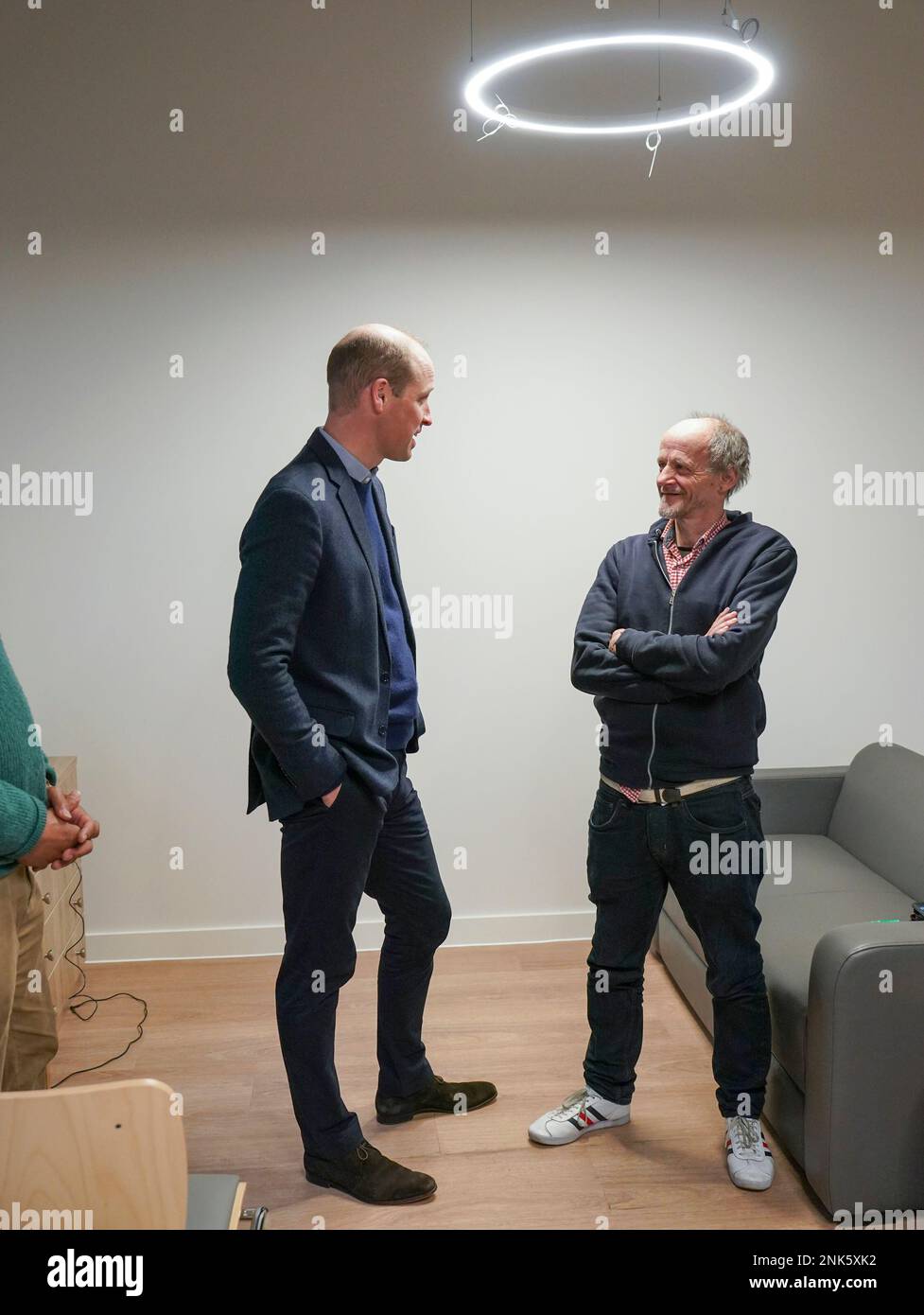 The Prince of Wales (left) speaks with resident Mark Chiverton, during ...