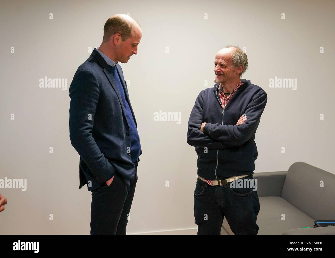 The Prince of Wales (left) speaks with resident Mark Chiverton, during ...