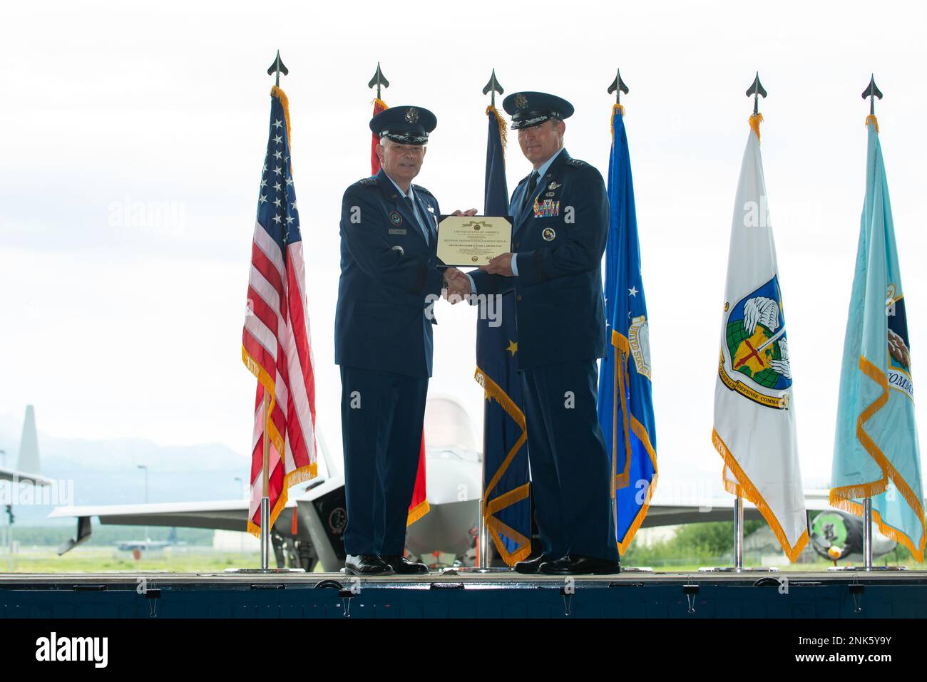 U.S. Air Force Gen. Glen D. VanHerck awards Lt. Gen David A. Krumm the ...