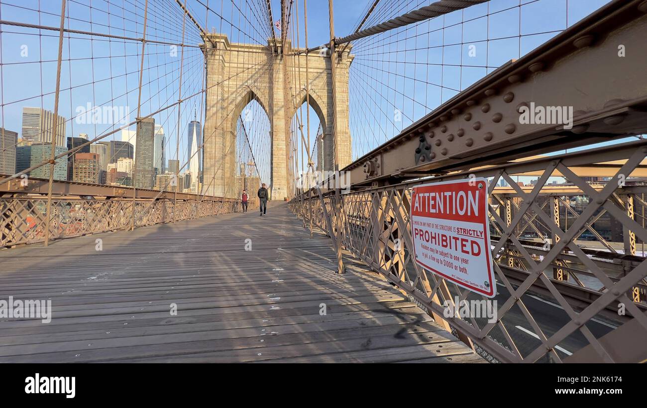 Signs with a warning against climbing the structures of the Brooklyn ...