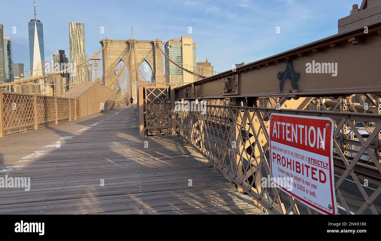 Signs with a warning against climbing the structures of the Brooklyn ...