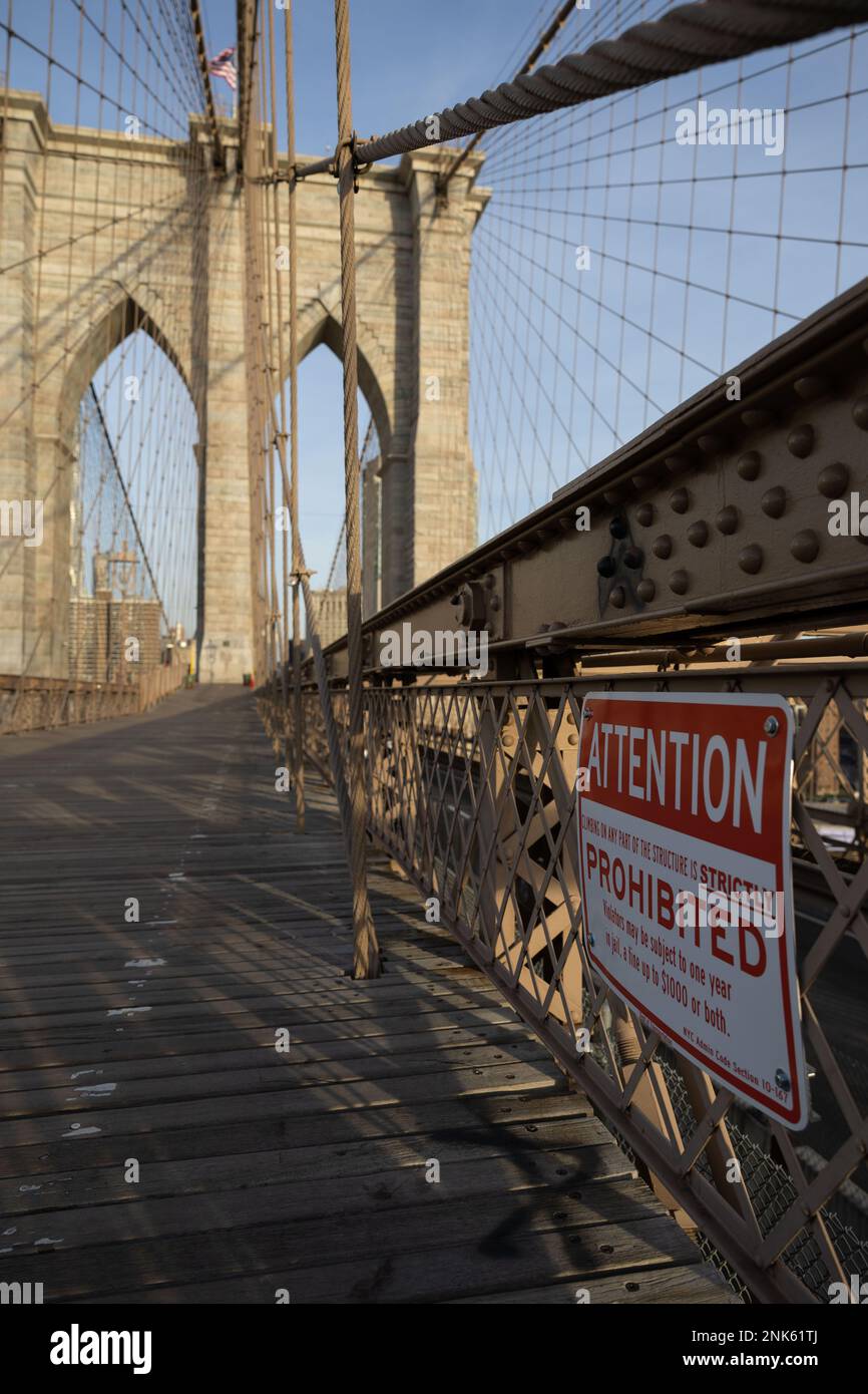 Signs with a warning against climbing the structures of the Brooklyn ...