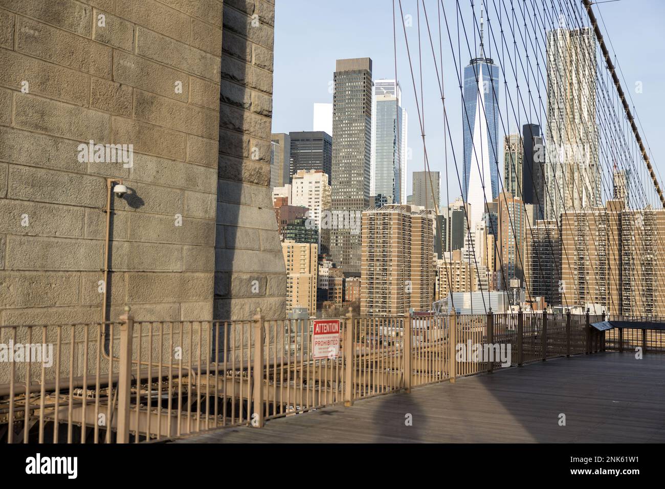 Signs with a warning against climbing the structures of the Brooklyn ...