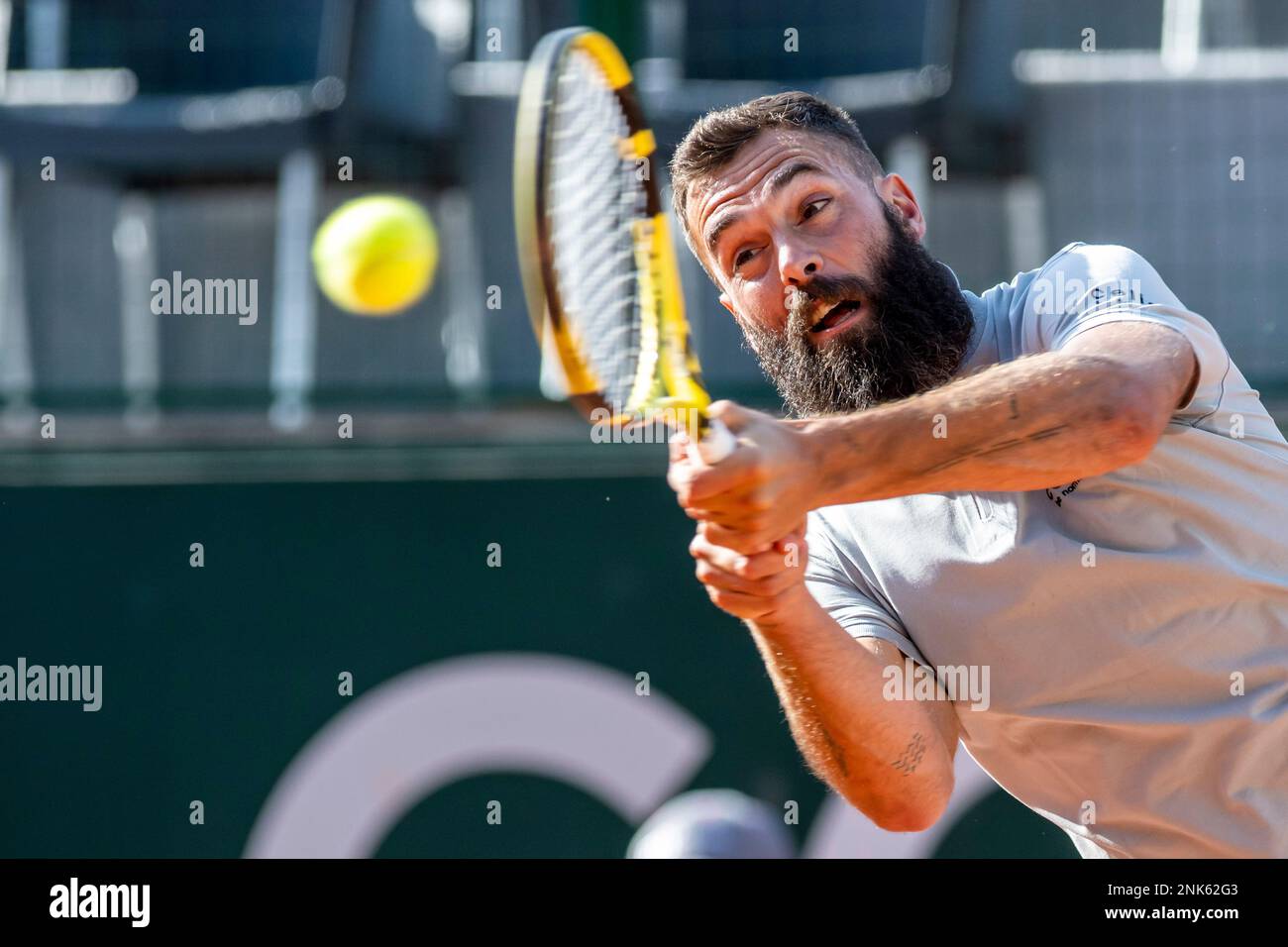 Benoit Paire, of France, returns a ball to Casper Ruud of Norway ...