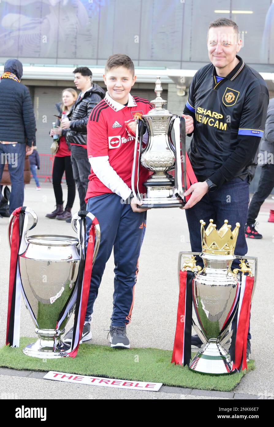 Manchester, UK, 23rd February, 2023. Football fans pose with replicas ...