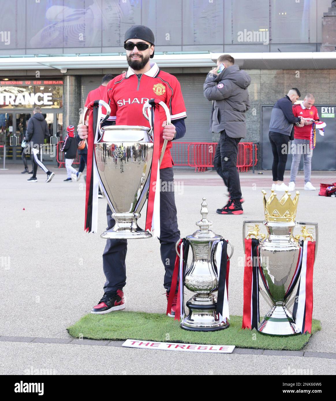 Manchester, UK, 23rd February, 2023. Football fans pose with replicas ...