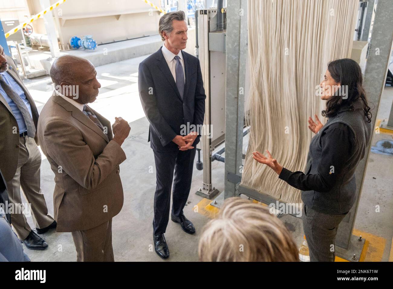 California Governor Gavin Newsom listens during a tour of a ...
