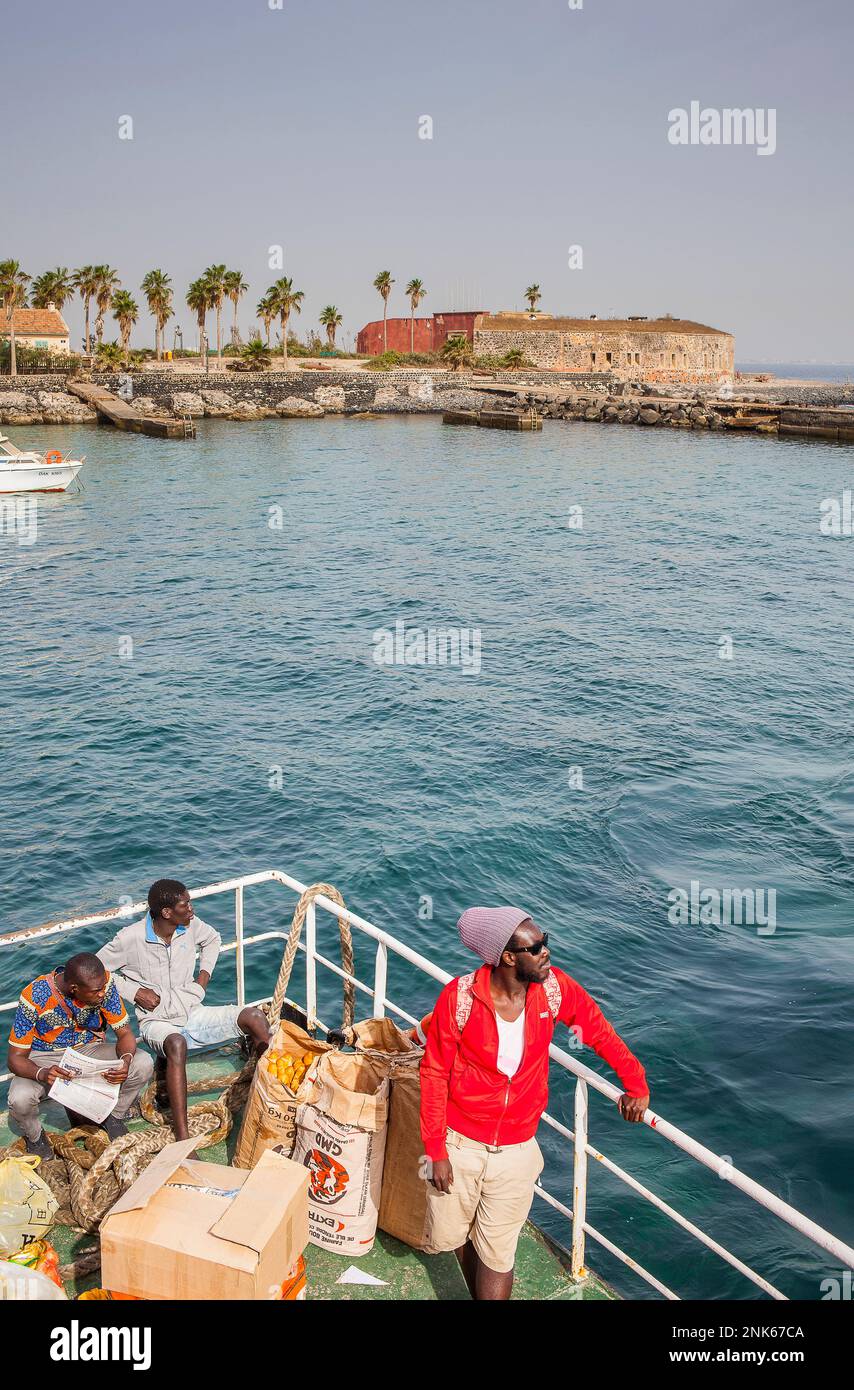 Ferry arriving at Goree Island, in background fort d´Estrees, near ...