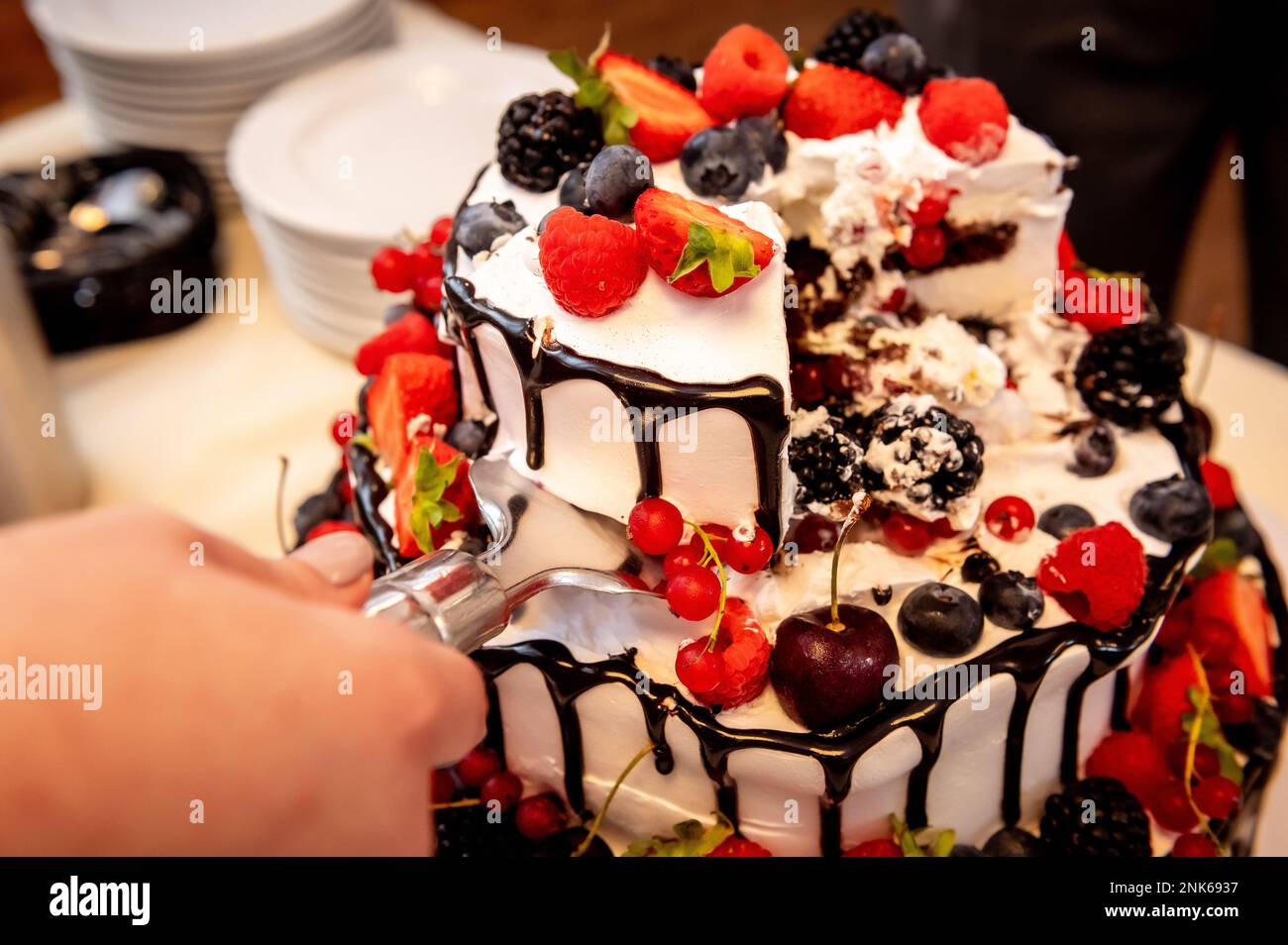 cutting a cake sweets, cake and cookies Stock Photo - Alamy