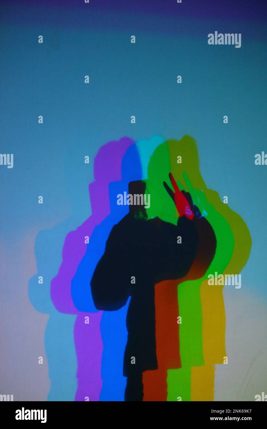 Colored Lamps Create Shadow Of Person Stock Photo - Alamy