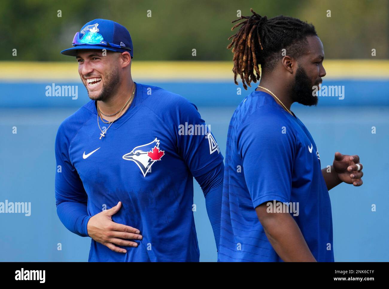 Toronto Blue Jays center fielder George Springer, left, laughs next to ...