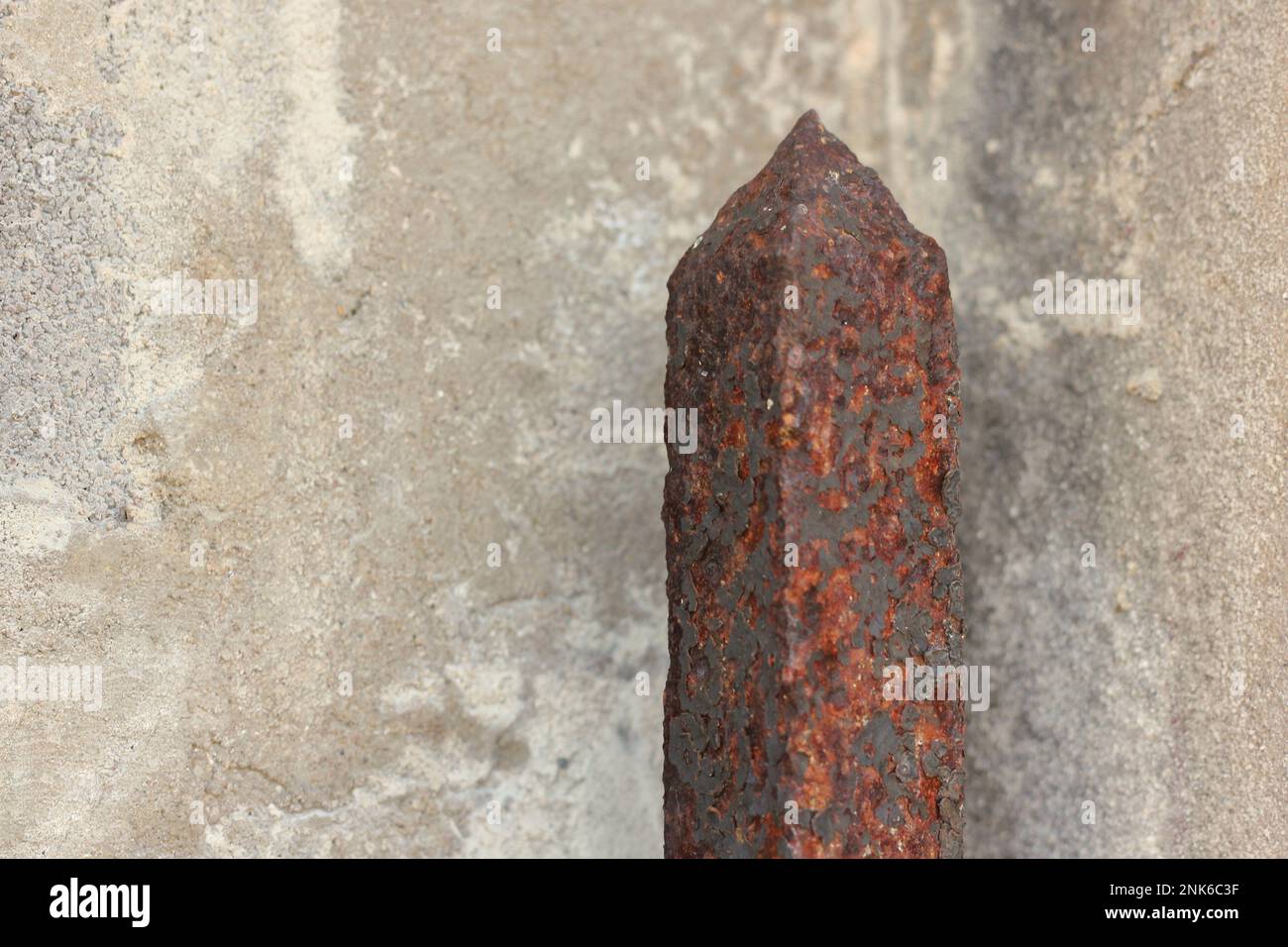 Vintage traditional rusty metal fence with sharp points as a protection ...