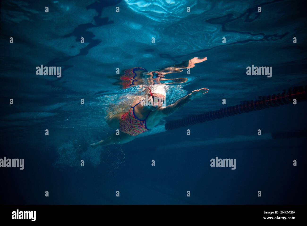 Front crawl. Speed. Young woman, professional swimmer in goggles and ...