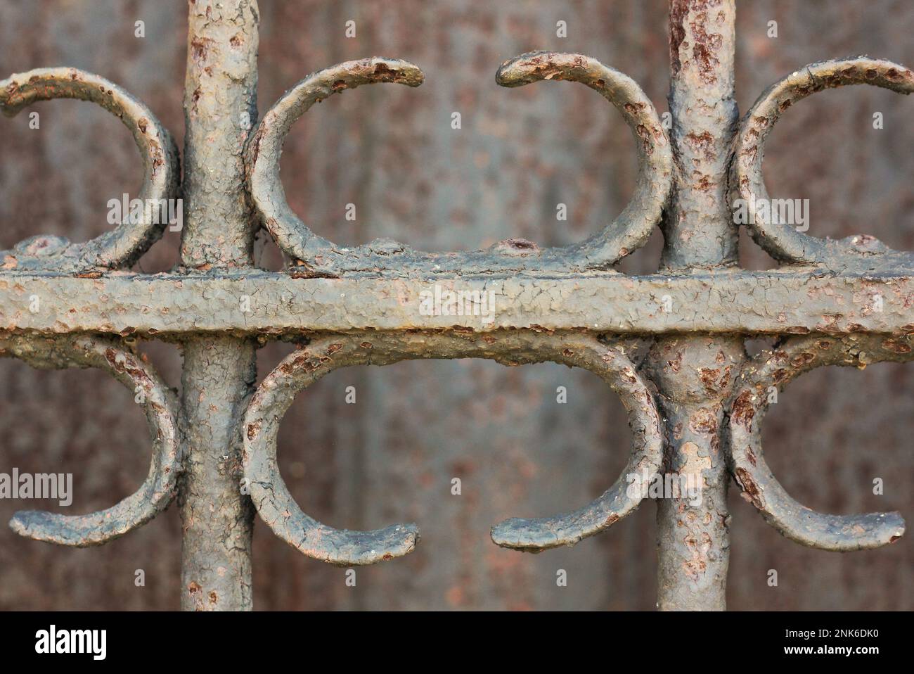 Rusted curly medieval metal gate decorations Stock Photo - Alamy