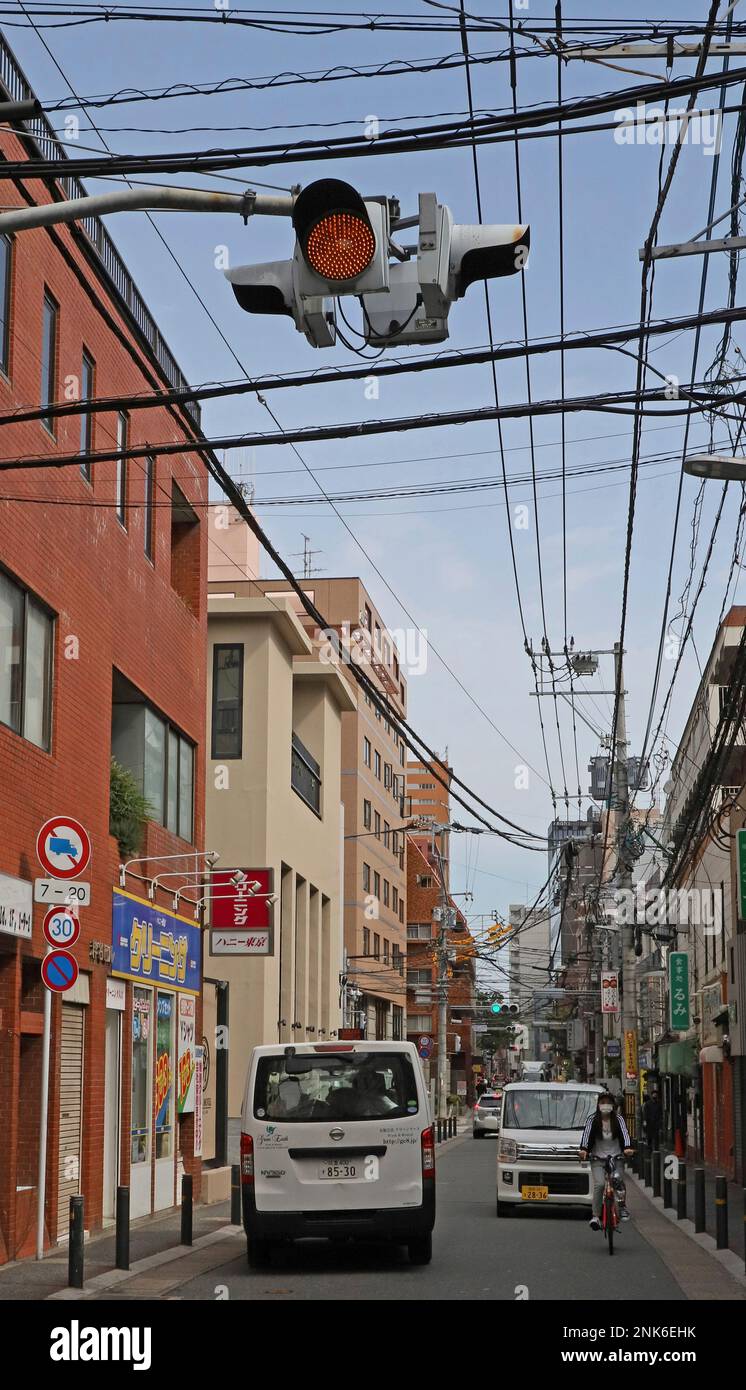 The red light of one light single traffic signal is flashing at ...