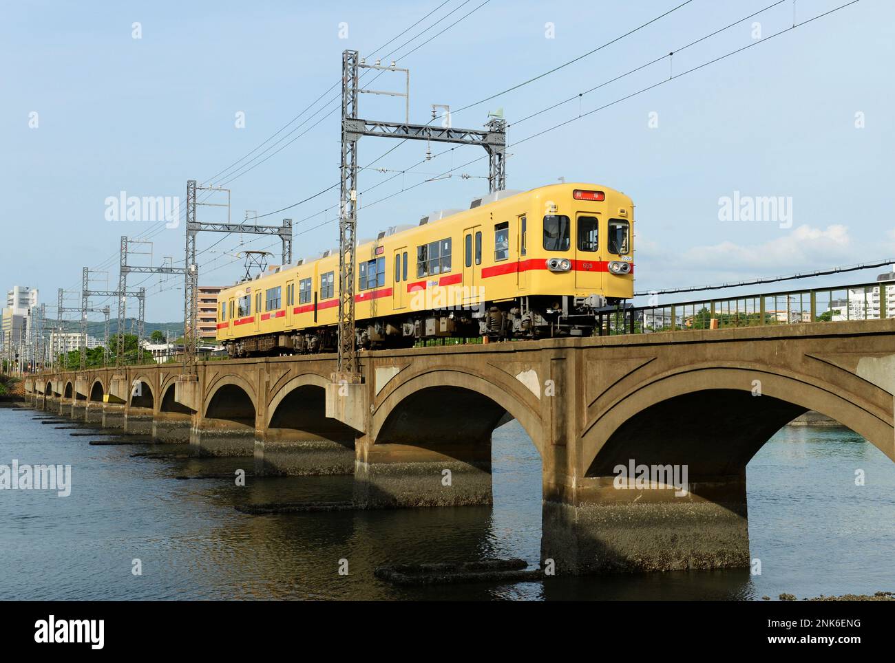 600 series train of the Nishitetsu Kaizuka Line crosses 10 arches bridg ...
