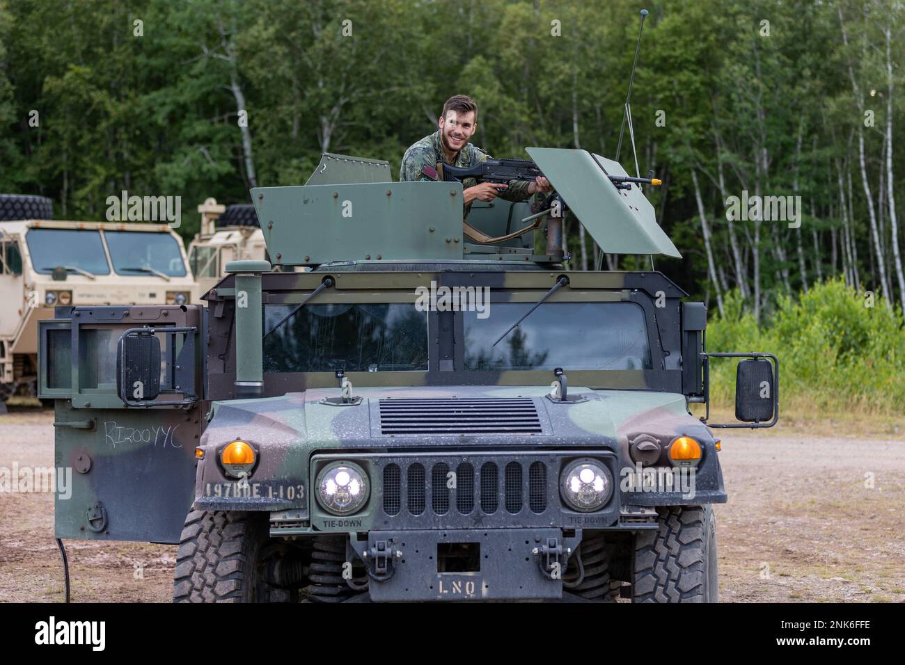 A Canadian soldier poses for a picture with his C6 machine gun in the ...