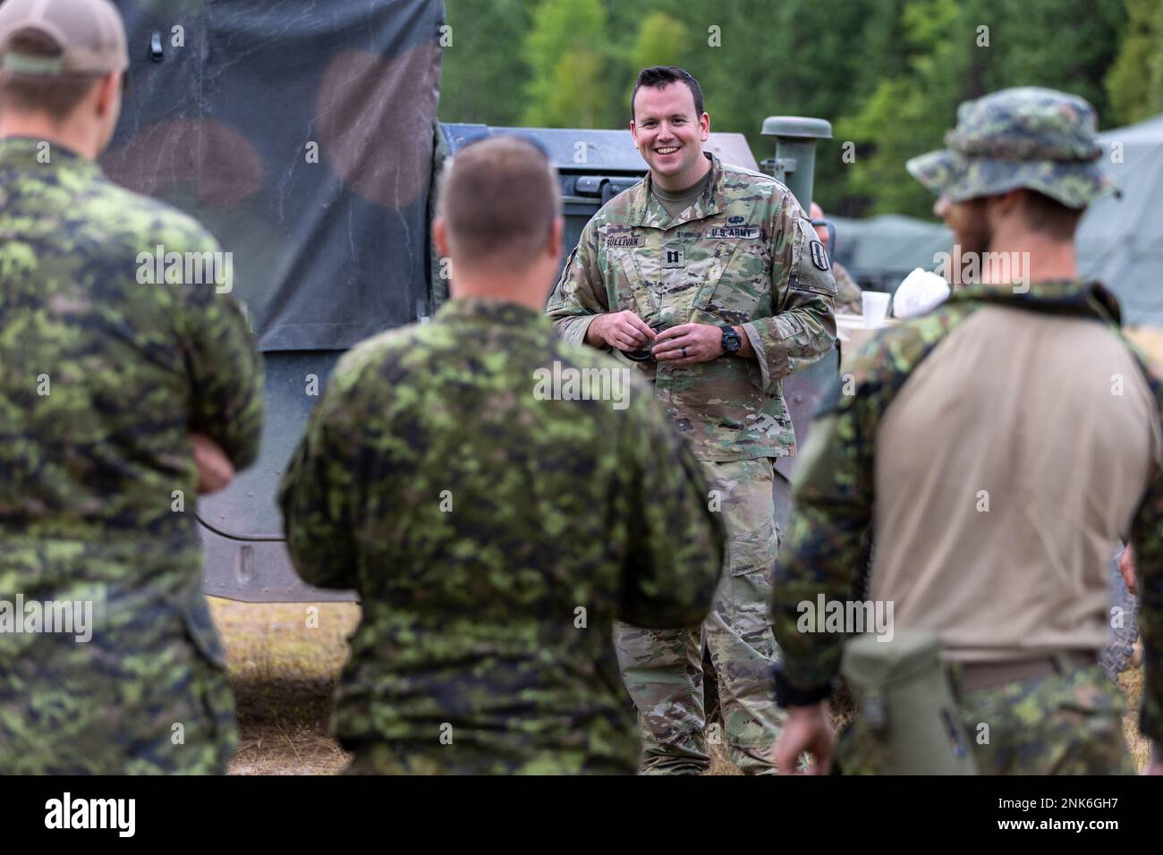 Captain Bryan Sullivan speaks to instructors from the Canadian Infantry ...