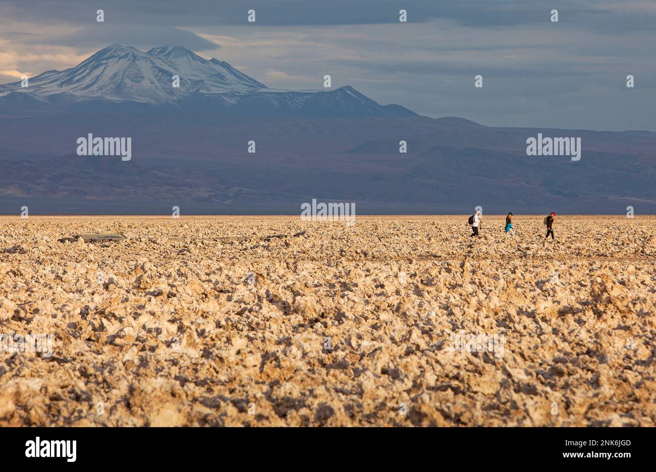 Walking across of Salt formations in Atacama Salt Flat, Atacama Desert ...