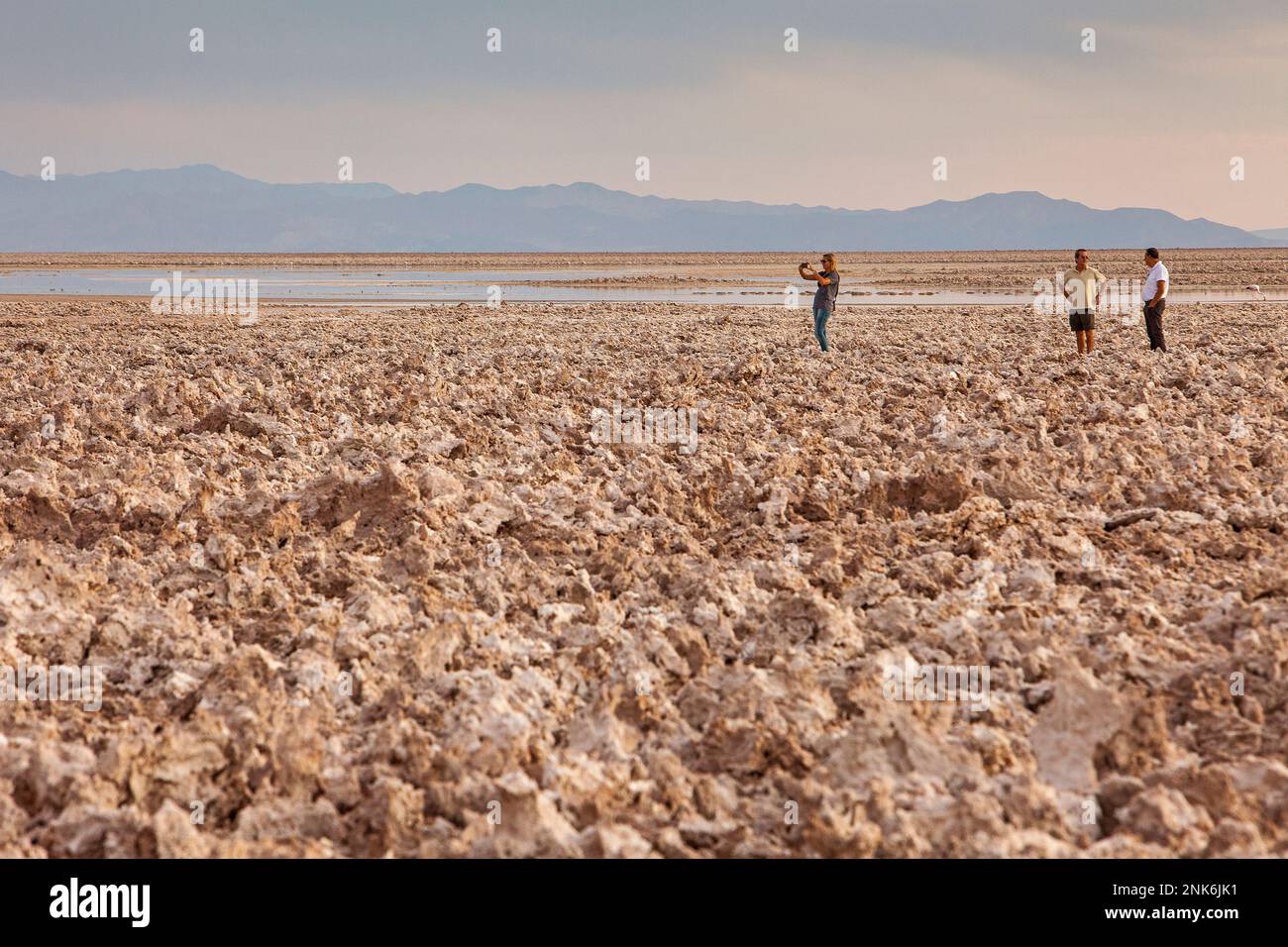 Walking across of Salt formations in Atacama Salt Flat, Atacama Desert ...