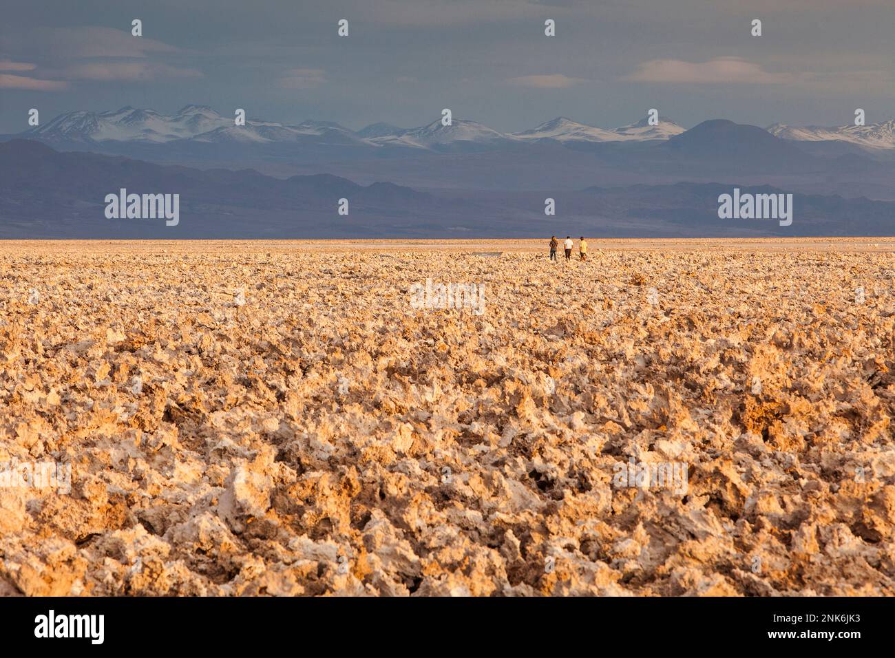 Walking across of Salt formations in Atacama Salt Flat, Atacama Desert ...