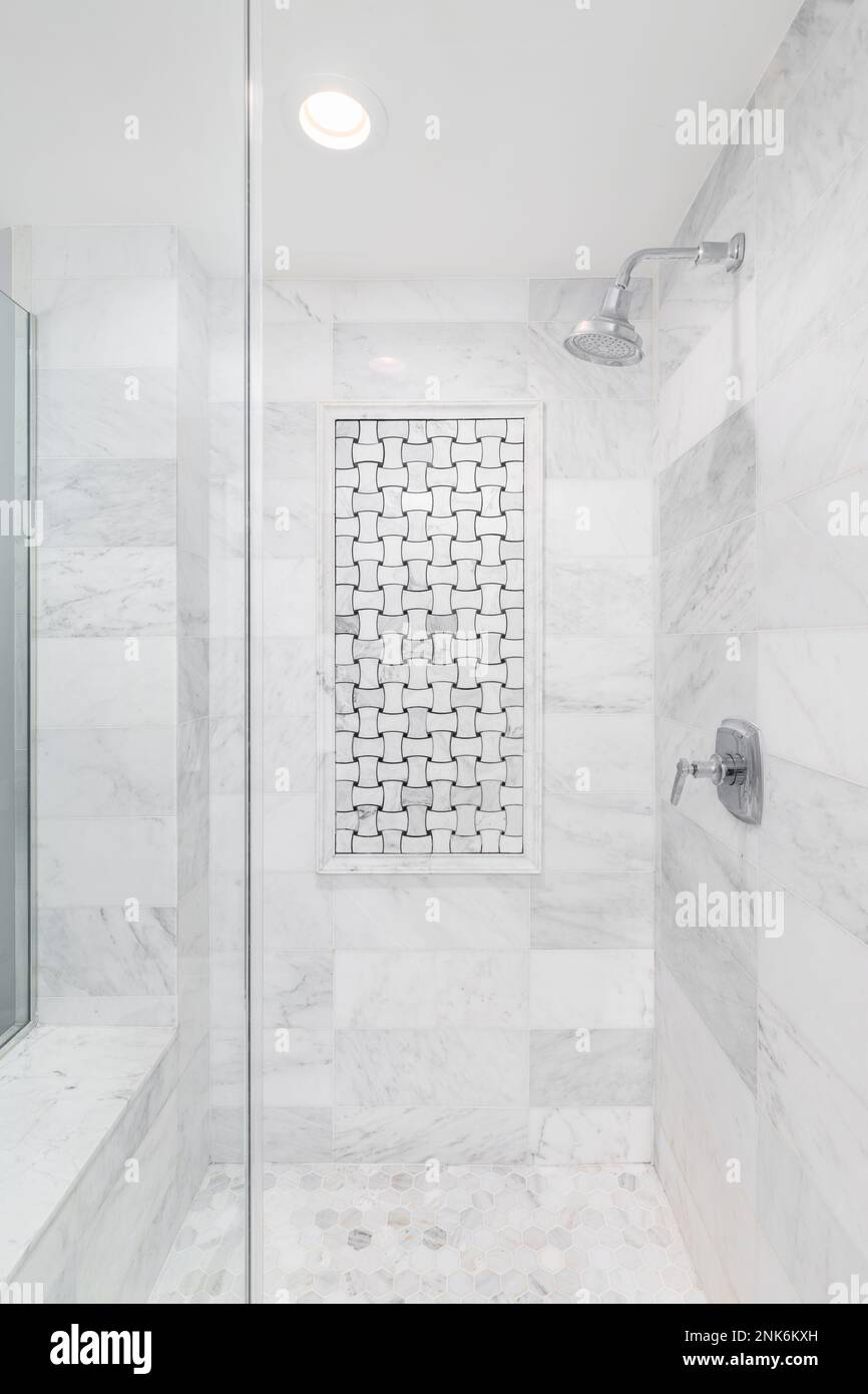 A shower with marble subway and hexagon tiles, an interlocking tile ...