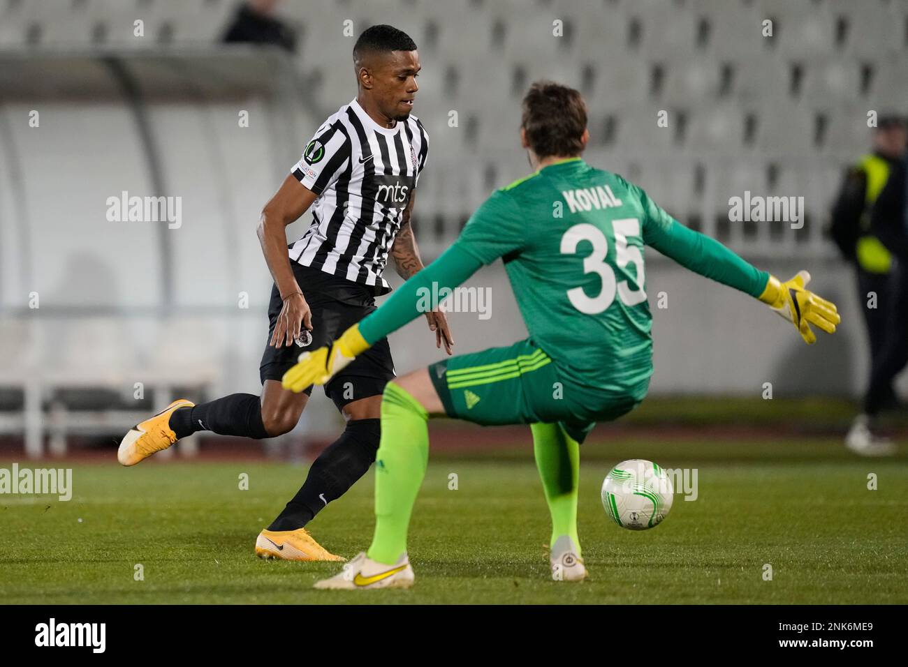 Partizan's Ricardo Gomes, left, attempts a shot at goal in front of ...
